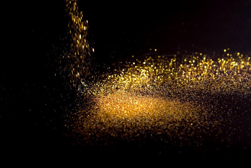 Sprinkle Gold Dust on a Black Background Stock Image - Image of glitter ...