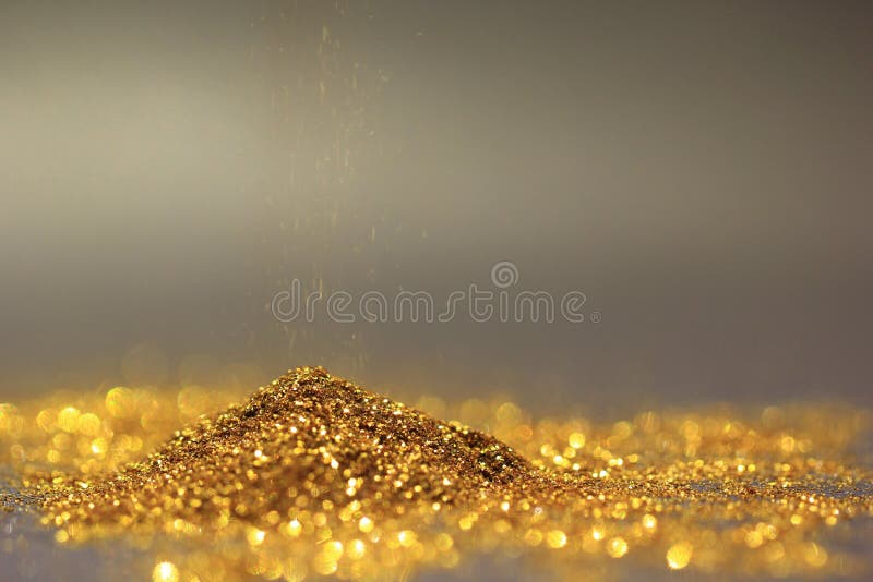 Sprinkle Gold Dust and Glitter Lights on Dark Background Stock Photo ...