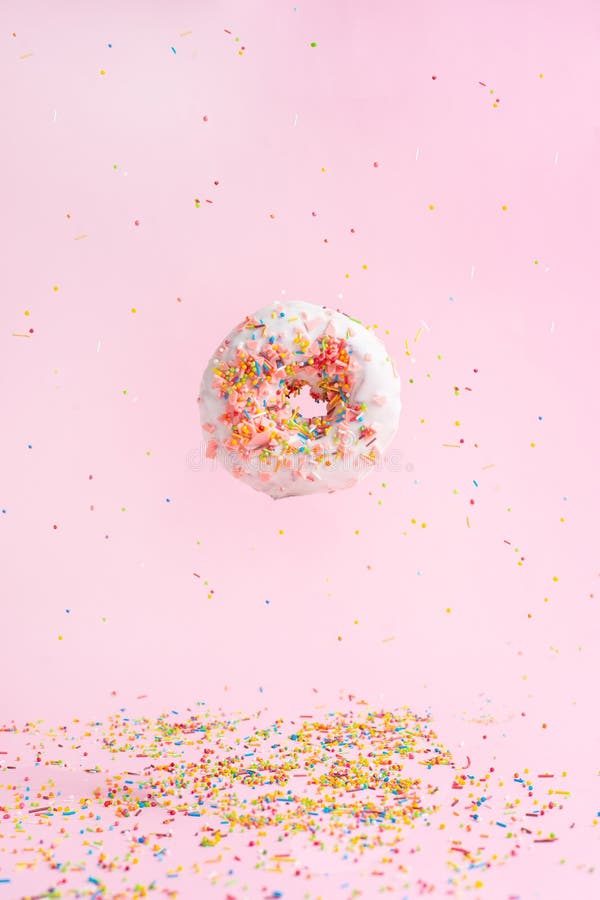 Sprinkle Pink Donut. on a Pink Background Stock Photo - Image of eaten ...