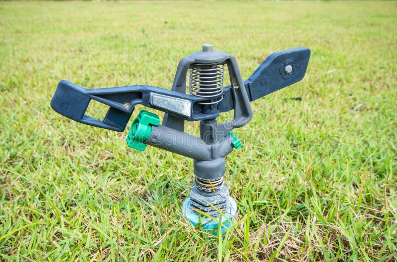 Sprinkler in field stock image. Image of environment - 178716945