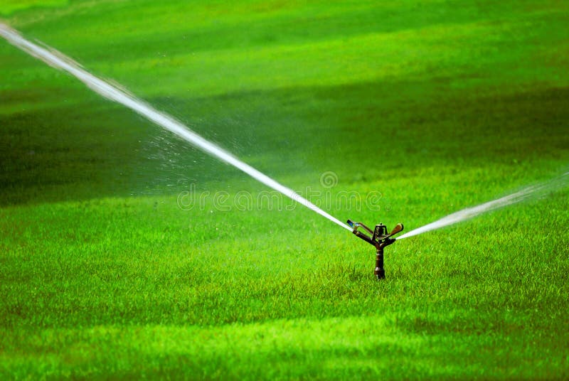 Sprinkler on Grass stock image. Image of velvety, shower - 30992811