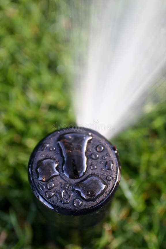 Sprinkler head spraying stock image. Image of sprinkler - 5480917