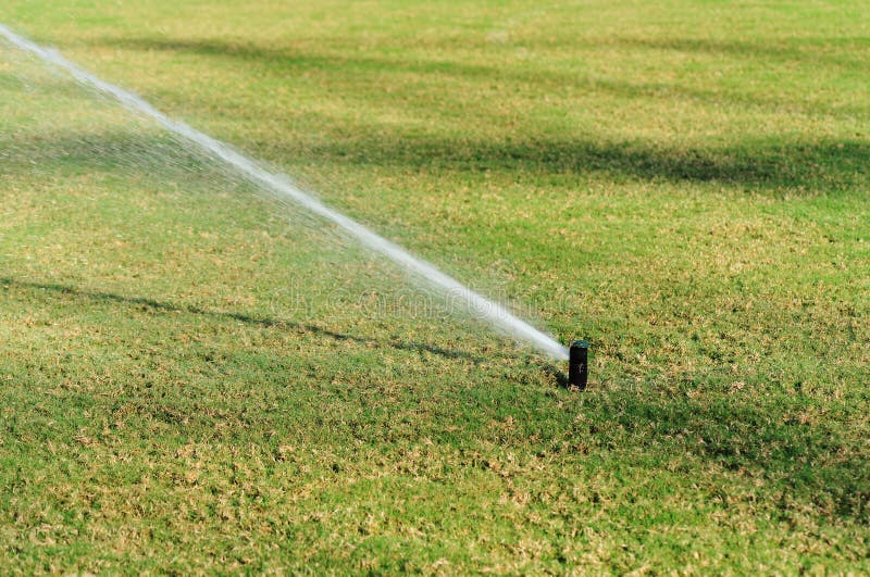 Sprinkling stock image. Image of green, pipe, field, football - 27858507