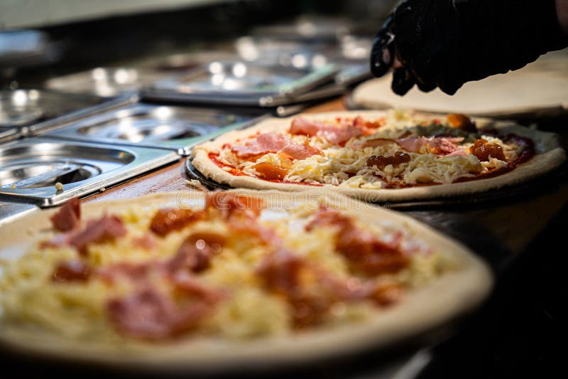 Sprinkling Cheese on Pizza Dough Stock Photo - Image of making, cooking ...