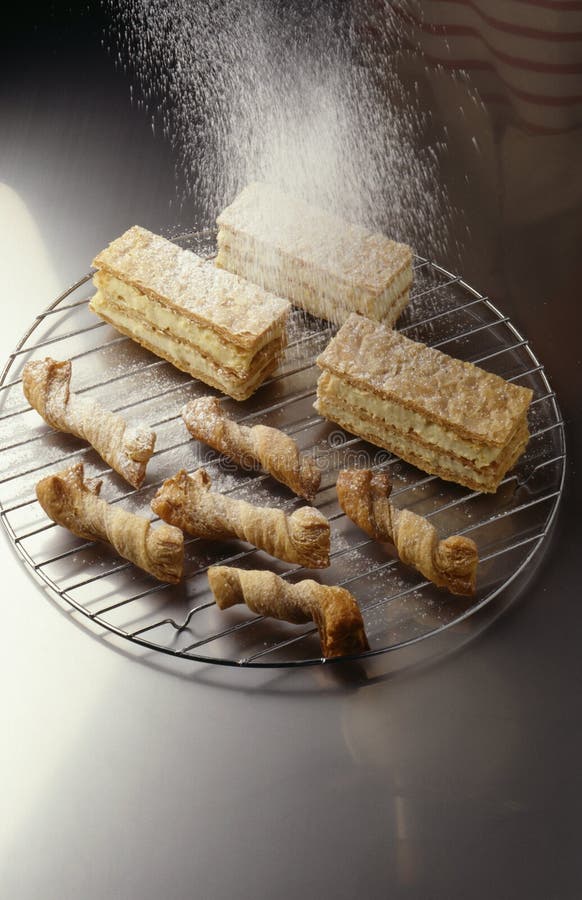 Sprinkling Icing Sugar Over the Pastries Stock Photo - Image of mille ...