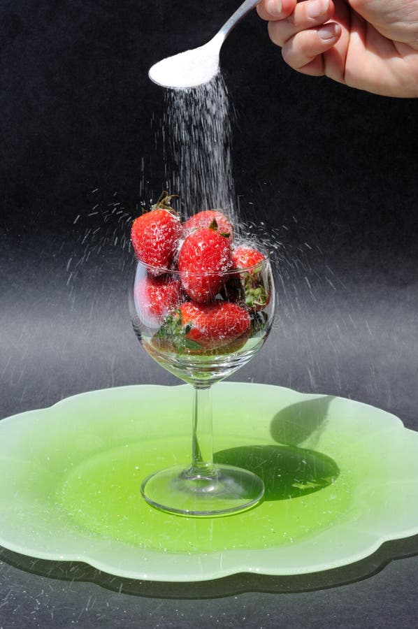 Sprinkling Sugar Onto Strawberries. Stock Image - Image of backdrop ...