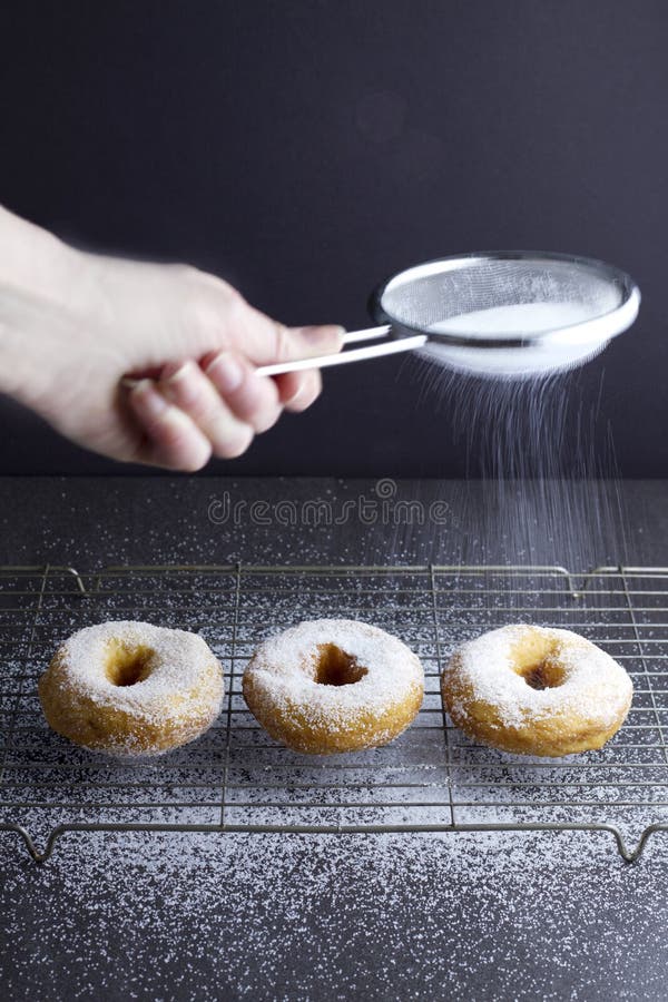 Sprinkling Sugar Over Freshly Baked Strudel Stock Photo - Image of ...