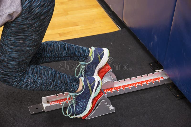 Sprinter in the Blocks for Speed Training Indoor in the Gym Stock Photo ...