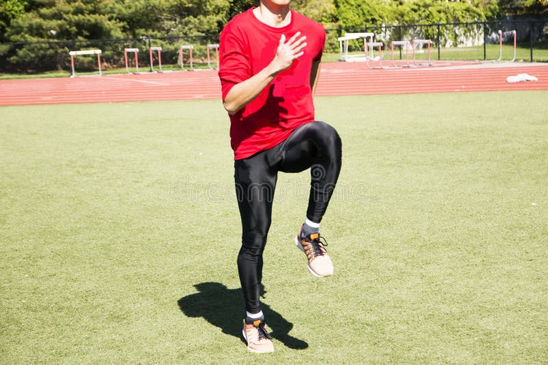 Sprinter doing form drills stock photo. Image of sprinting - 93747648