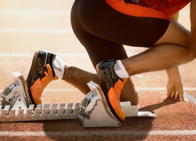 Runner in starting blocks stock image. Image of track - 13050567