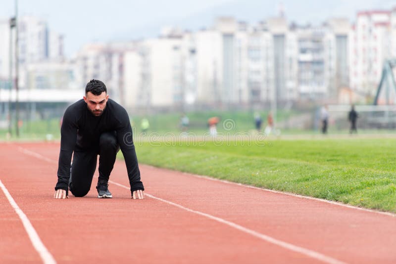 Male Sprinter Getting Ready To Start the Race Stock Photo - Image of ...