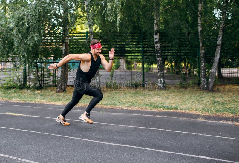 The Sprinter Runs at Maximum Speed. Man Doing Track and Field Athletics ...