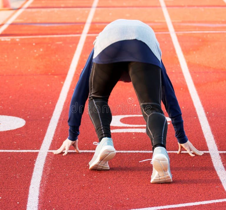 Sprinter in the Set Position on a Red Track Stock Image - Image of ...