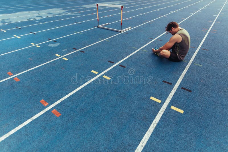 Sprinter Doing Warm Up Exercises Standing in a Stadium Stock Photo ...
