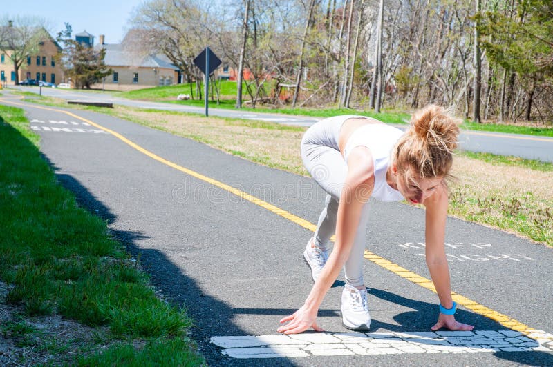 Sprinter Woman Getting Ready To Start on the Running Track Stock Image ... Sprinter Woman Getting Ready To Start on the Running Track Stock Image ...