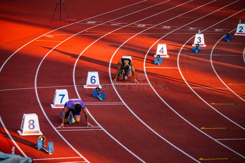 Sprinters Ready To Begin the 200m Race, Captured at the Precise Moment ...