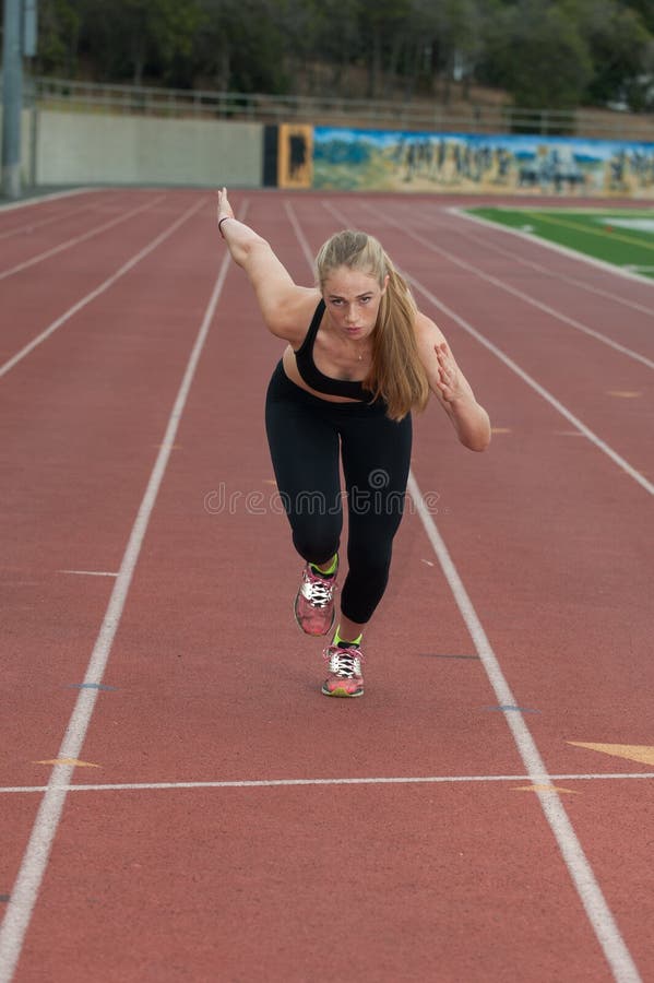 Sprinting on the track stock photo. Image of runner, female - 75394918