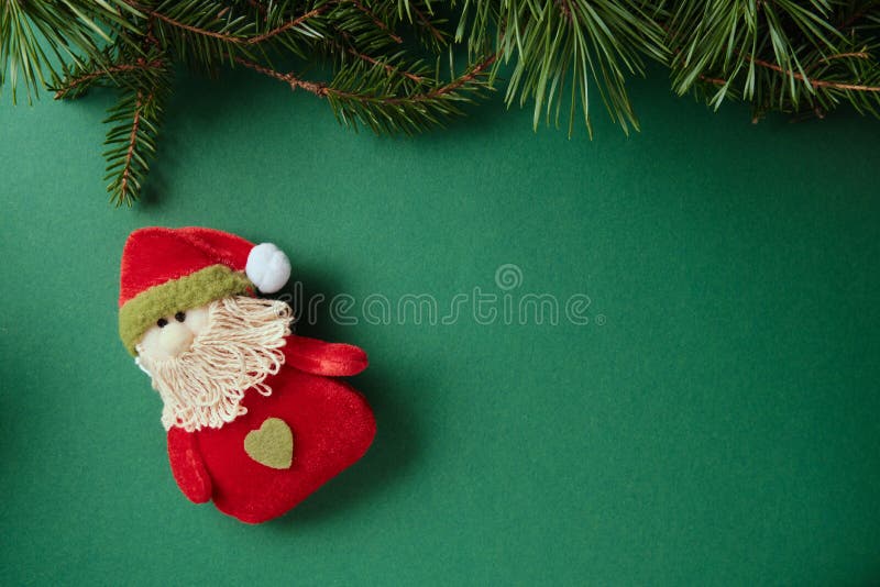 Spruce Branches and Ragged Santa on a Green Background. Copy Space ...