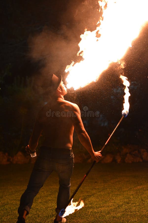 Sptting fire stock photo. Image of darkness, flame, shirtless - 57731782