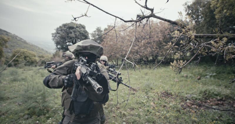 Squad of Fully Armed Commando Soldiers during Combat in a Forest ...