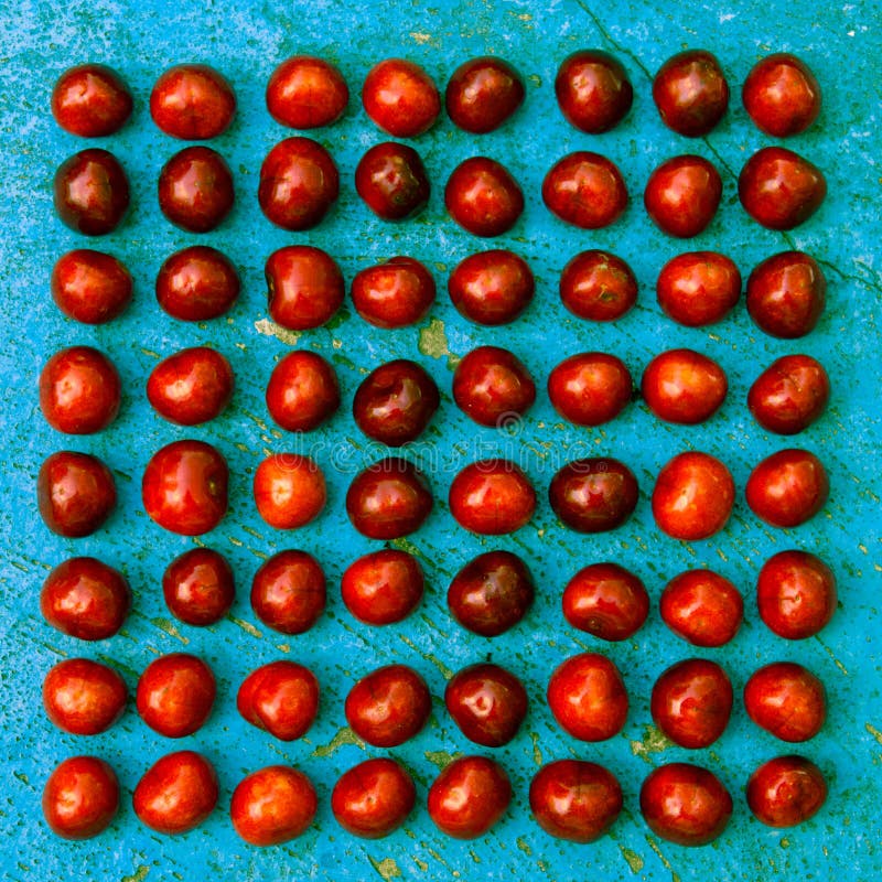 Square Arrangement of Ripe Cherries on Blue Textrured Background Stock ...