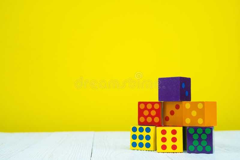Square Block Puzzle Toy on Table with Yellow Background Stock Image ...