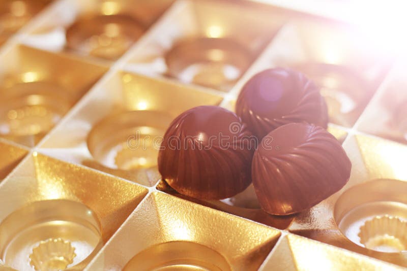 A square box of chocolates stock image. Image of indulgence - 106143453