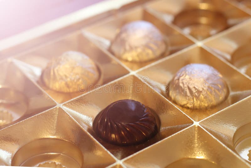 A square box of chocolates stock photo. Image of decorative - 106143500