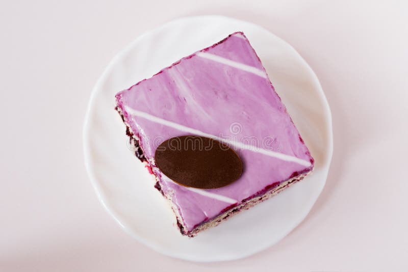 Square Cake with a Piece of Chocolate on Top Stock Photo - Image of ...