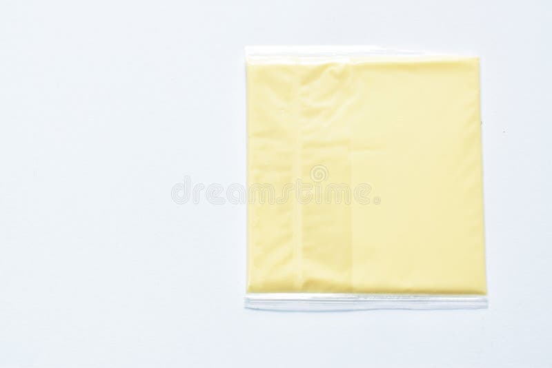 Square Cheese in Clear Plastic Packing on White Background Stock Image ...