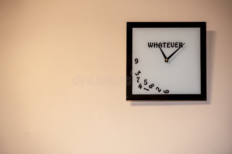 A Square Clock without Numbers Hangs on the Wall. a Watch with an ...
