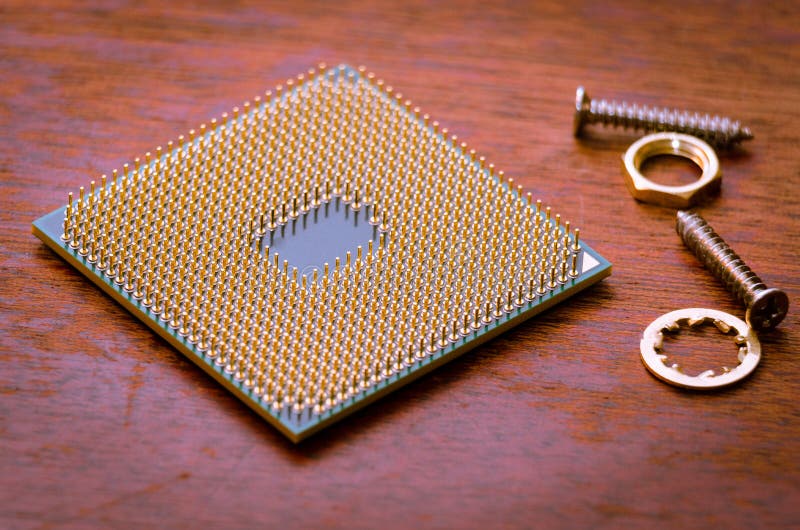 A Square Computer Processor Pulled from a Broken Computer. the Processor is on the Table. Stock ...