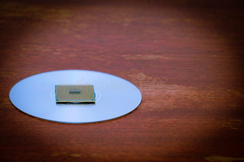 A Square Computer Processor Pulled From A Broken Computer The Processor Is On The Table Stock