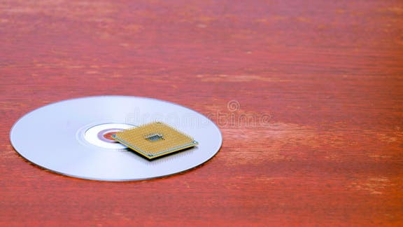 A Square Computer Processor Pulled from a Broken Computer. the Processor is on the Table. Stock ...