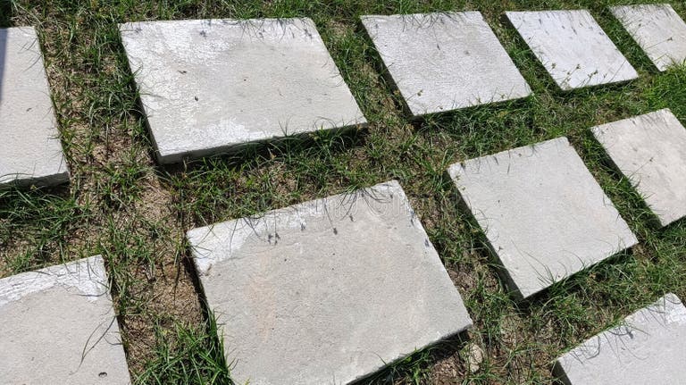 Square Concrete Blocks Placed on the Ground, Forming a Simple and ...