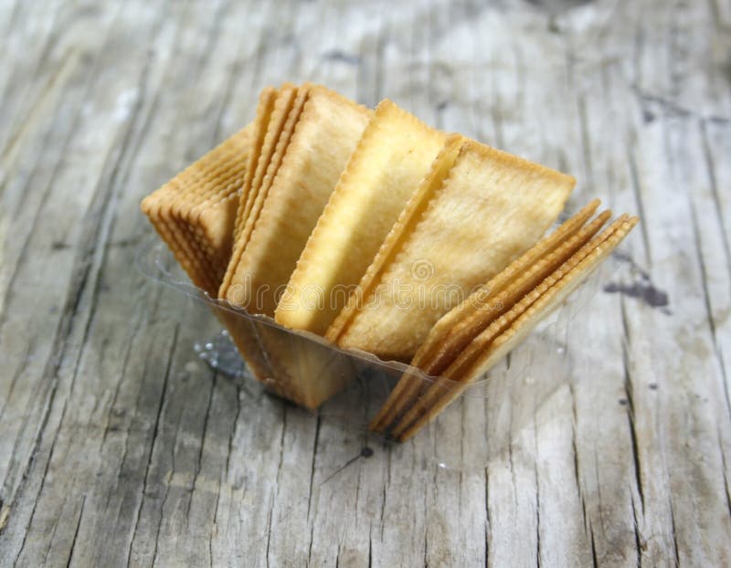 Square crackers on wooden stock image. Image of cracker - 36399189