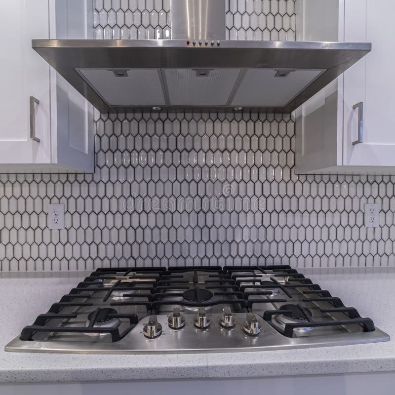 Square Crop Modern Gas Cooker Hob Under an Extractor Fan Stock Photo ...