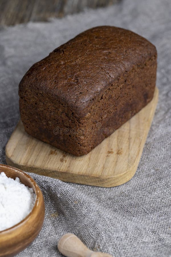 A Square Dark Loaf of Bread on the Table Stock Photo - Image of ...