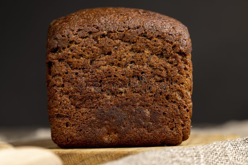 A Square Dark Loaf of Bread on the Table Stock Photo - Image of grain ...