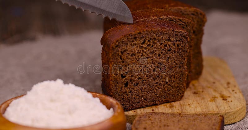 A Square Dark Loaf of Bread on the Table Stock Photo - Image of ...