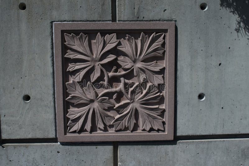 Decorative Stone Tile with Leaf Pattern on Concrete Wall Stock Photo ...