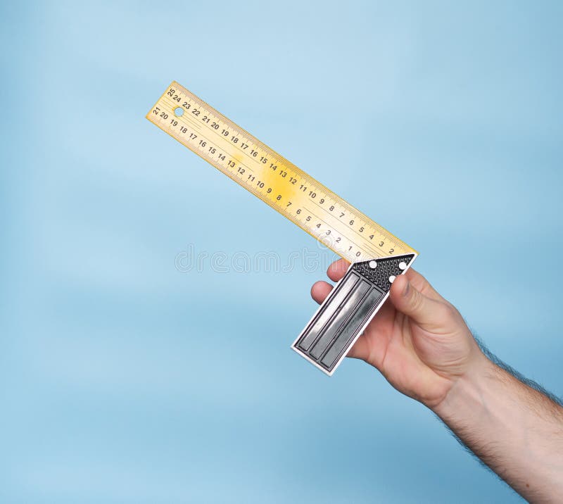 Square 90 Degrees Tool in a Man S Hand on a Blue Background, the ...