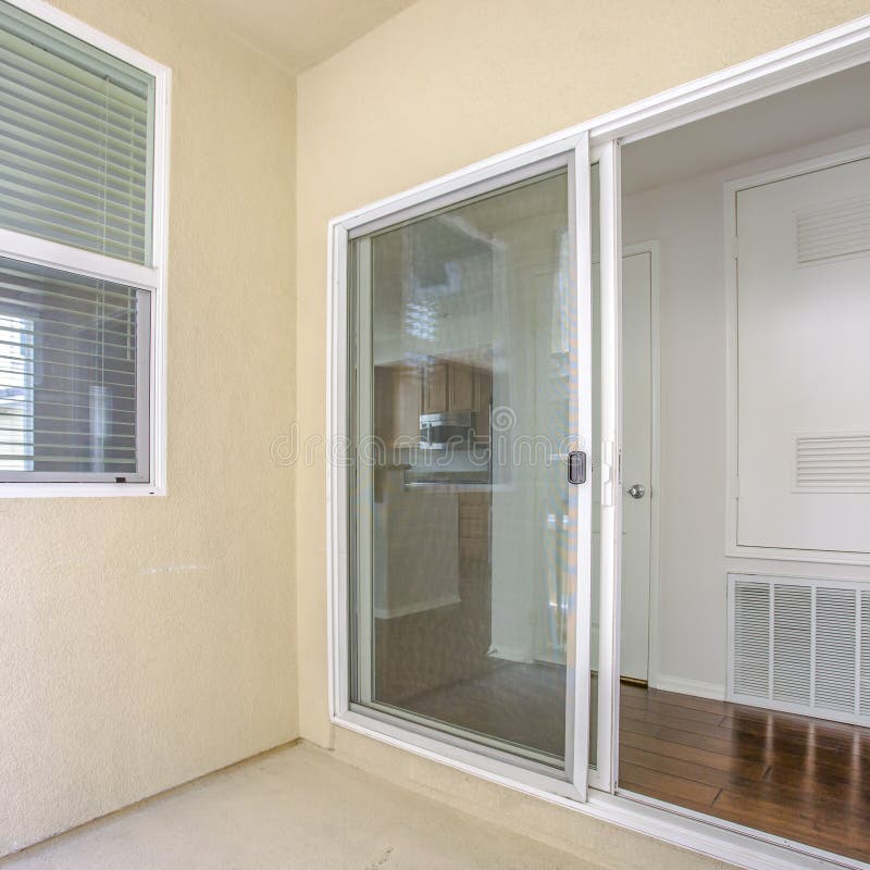 Square Sliding Glass Doors from the Patio Stock Image - Image of warm ...