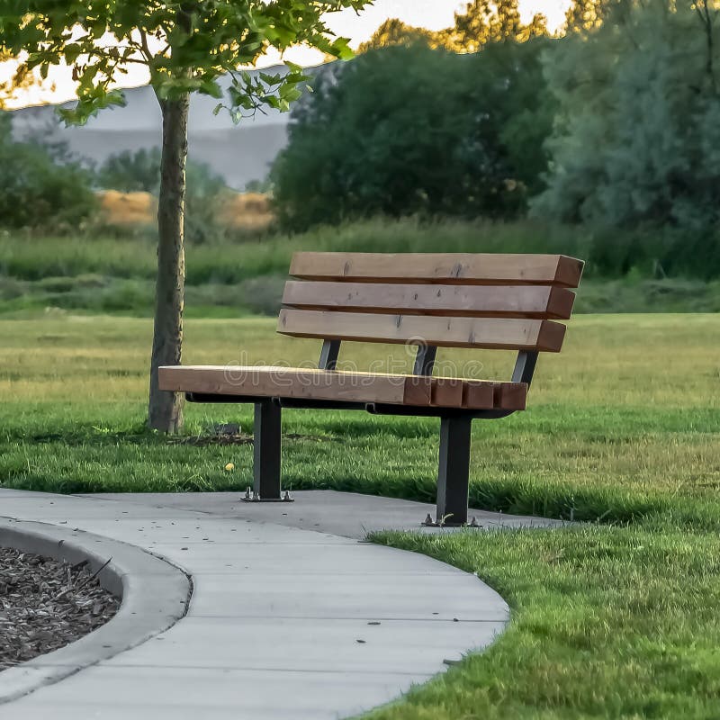 Square Frame Bench and Circular Pathway on a Grass Covered Terrain ...