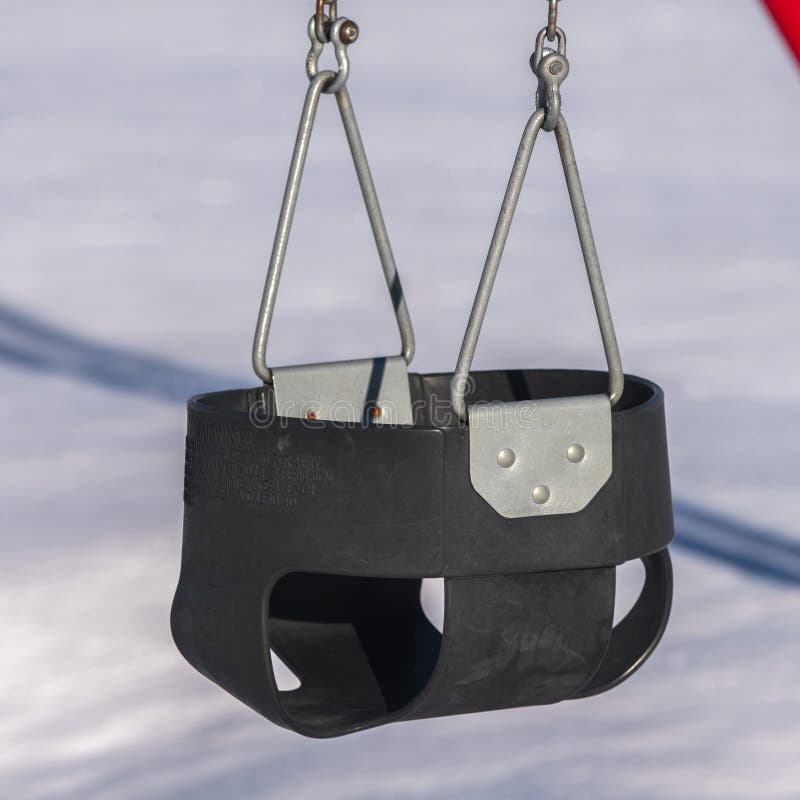 Square Frame Close Up on an Empty Swing in a Playground Stock Photo ...