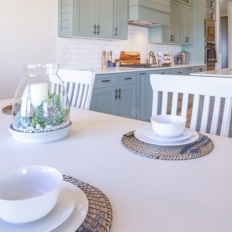 Square Frame Dining Room Table Setting of Home with White Tableware ...