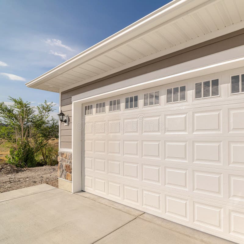Square Frame Double Garage of Modern Home on Sunny, Clear Day Stock ...