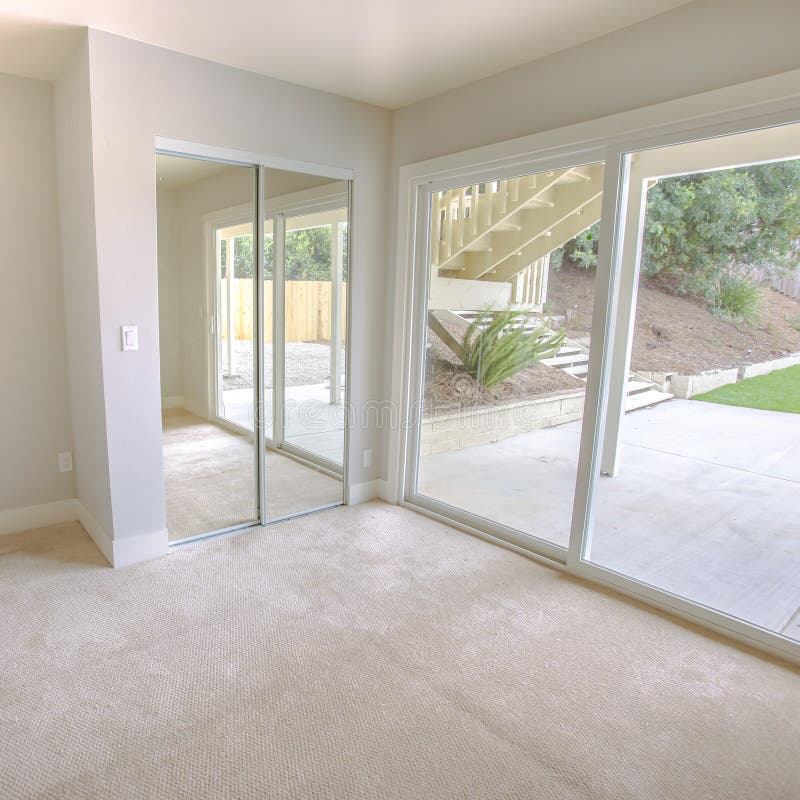 Square Frame Empty Bedroom with Sliding Glass Doors Stock Image - Image ...