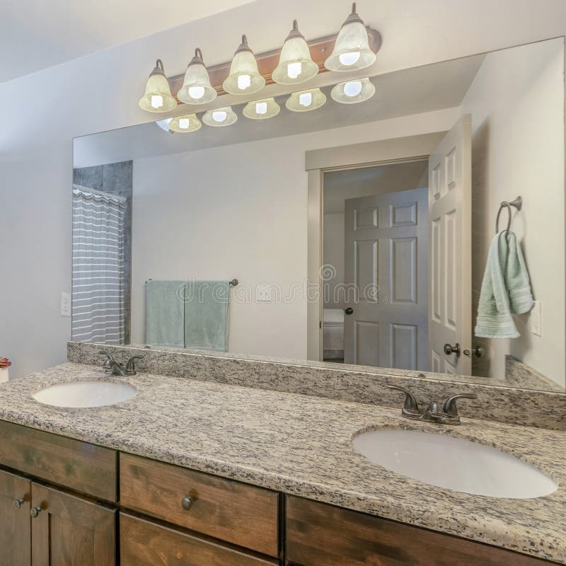 Square Frame Interior of a Bathroom with Vanity Sink with Lights and ...