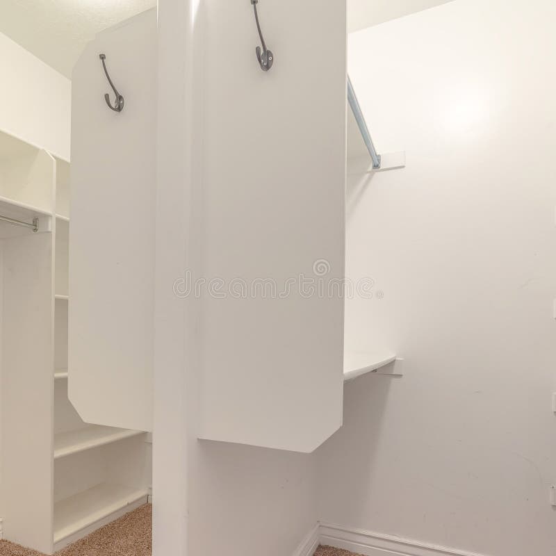 Square Walk in Closet with Double Hinged Doors Plain White Wall and ...
